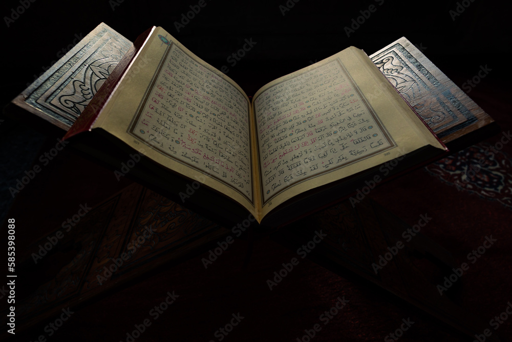 Islamic background photo. The Holy Quran or Kuran-i Kerim in focus ...