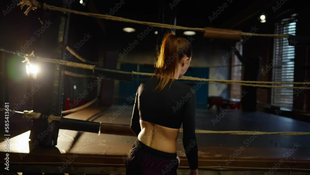 Barefooted woman boxer fighter in sportswear with ponytail going to ...