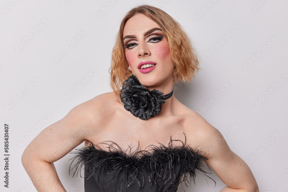 Indoor shot of transgender man poses with self confident expression ...