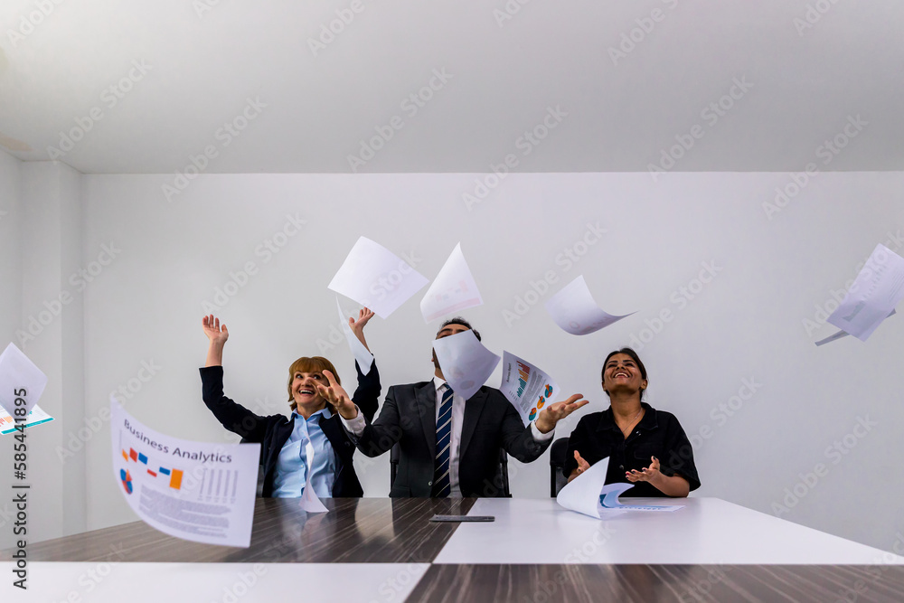 Teamwork business people throw papers and documents fly in air. Success ...