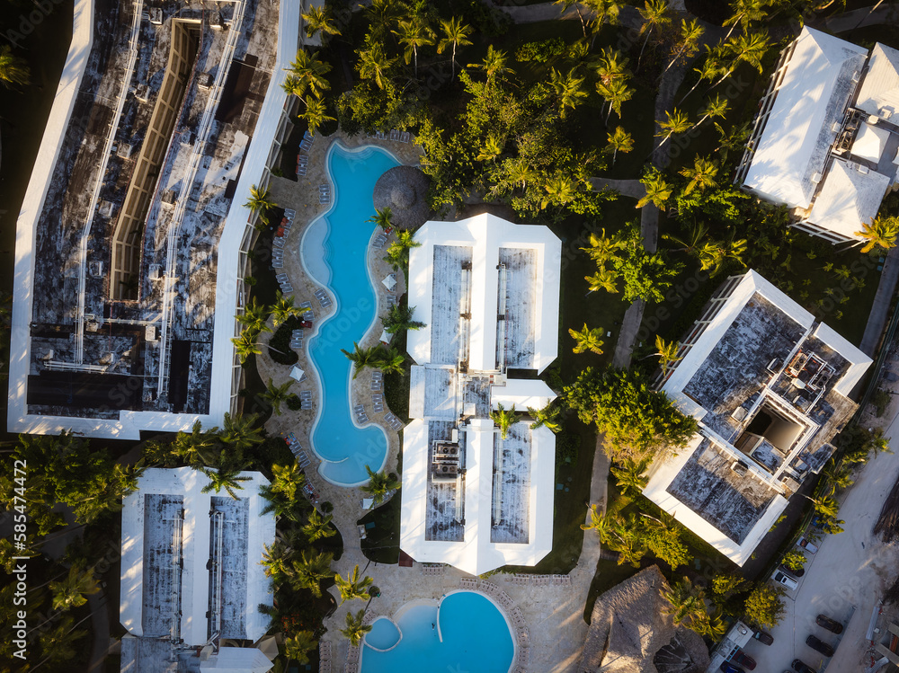 Aerial view of hotel complex with swimming pools, tropical plants ...