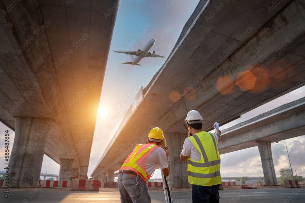 Two Asian worker engineer man and woman architect looking construction ...
