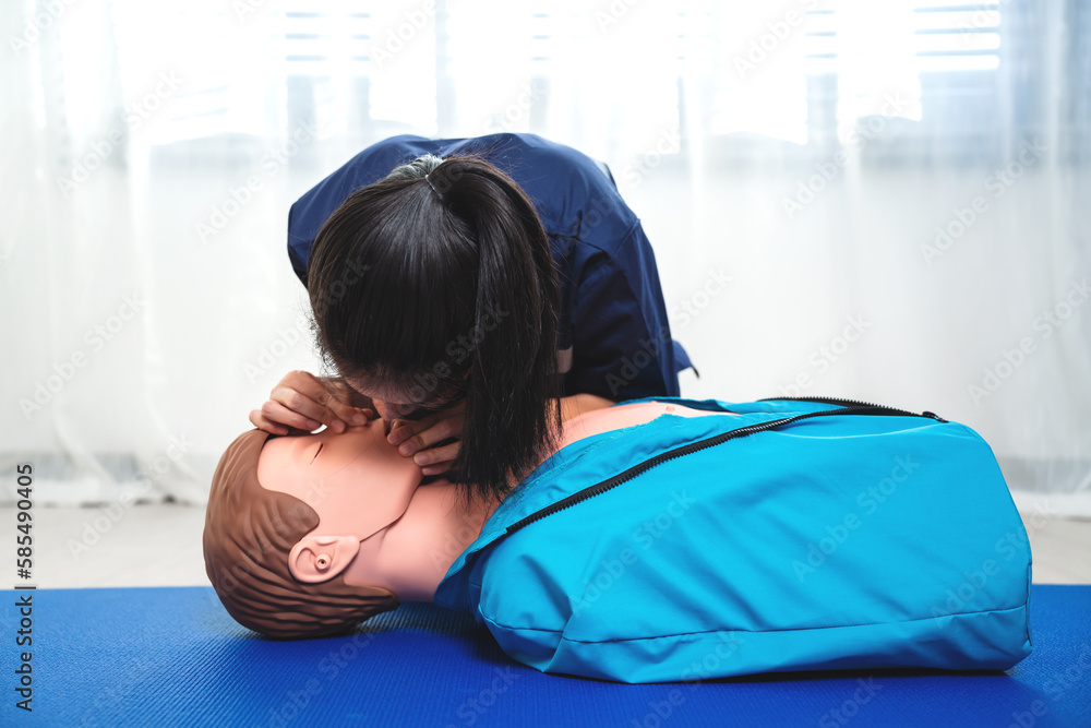 Emergency CPR Training on dummy , open the victim 's airway and give ...