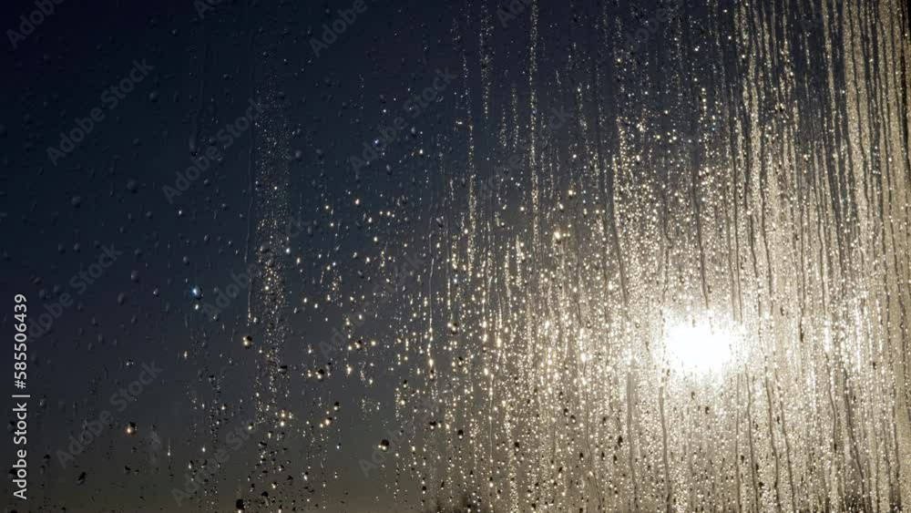 Vidéo Stock Shimmer Raindrops Flow Down the Glass on a Blurred ...