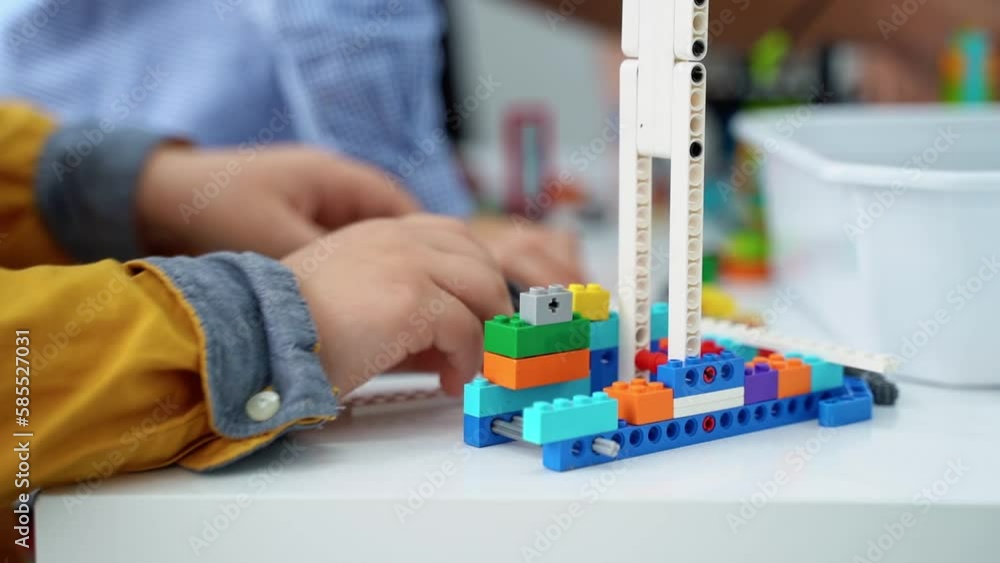 Robotics programming class. Children construct and code Robot. STEM ...