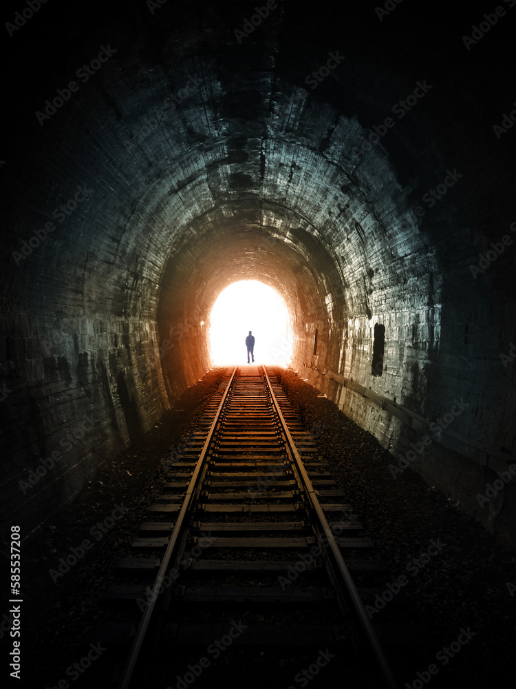Life after death. Man walking to the end of a tunnel. Metaphor fantasy ...