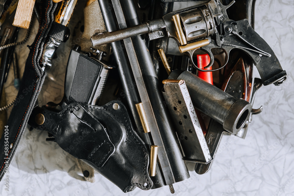 Weapons of various calibers, a rifle, a metal revolver with cartridges ...