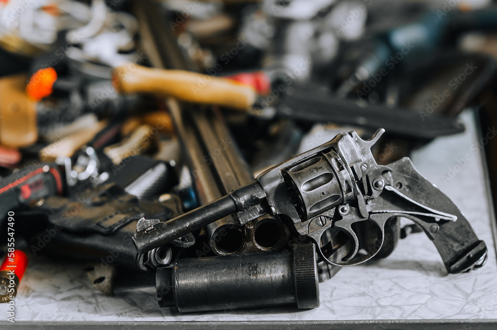 Weapons of various calibers, a rifle, a retro revolver with cartridges ...