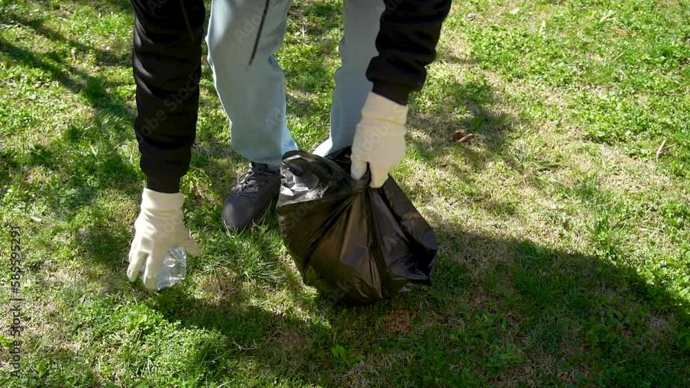 Man activist clean up littering rubbish at the public park, promote ...
