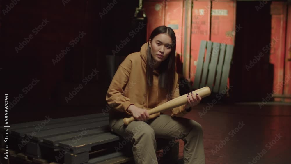 Rough displeased attractive Asian gang woman in street style clothes ...