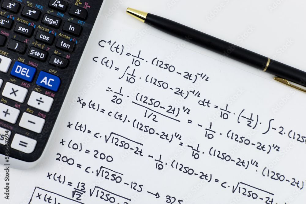 Mathematics Tools: Calculator and Handwriting. Close-up office desk ...