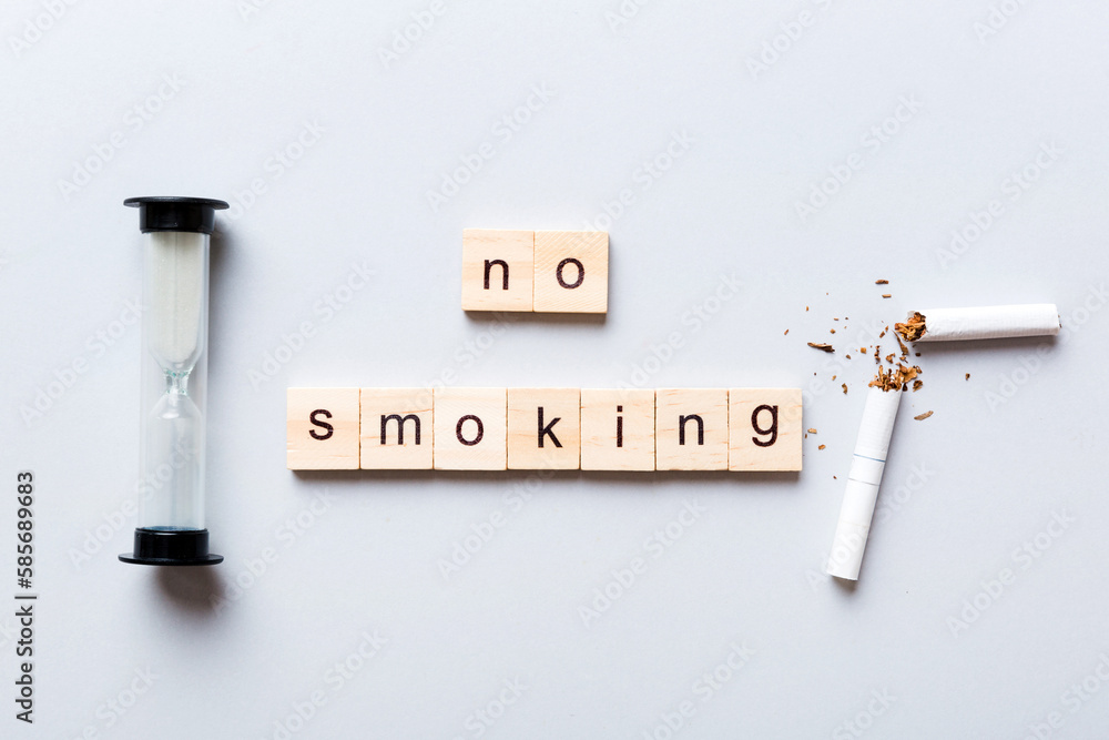 Cigarette And Wooden Blocks, Broken cigarette on table background with ...