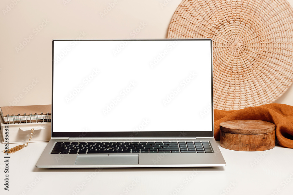 Aesthetic mockup laptop with white screen on the table with linen cloth ...