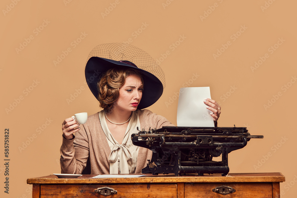 Attractive woman writer wearing old-fashioned clothes sitting at ...