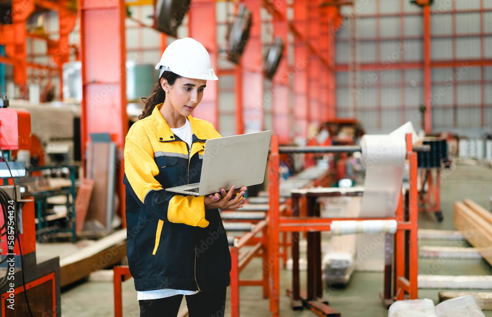 Industrial Engineer wears safety helmet work in heavy metal engineering ...