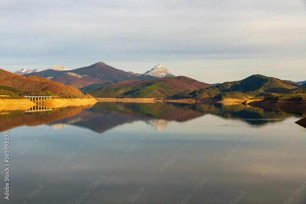 Peak of rocky limestone rock, surrounded by forests and mountains ...
