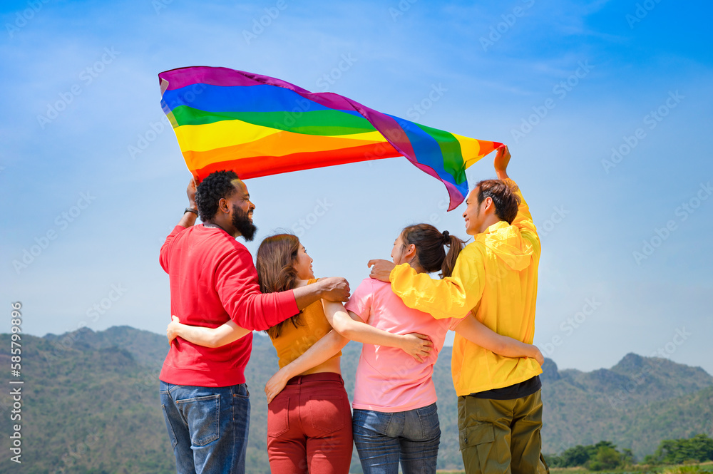 group of diverse lgbtq friends wearing colorful clothes, standing side ...