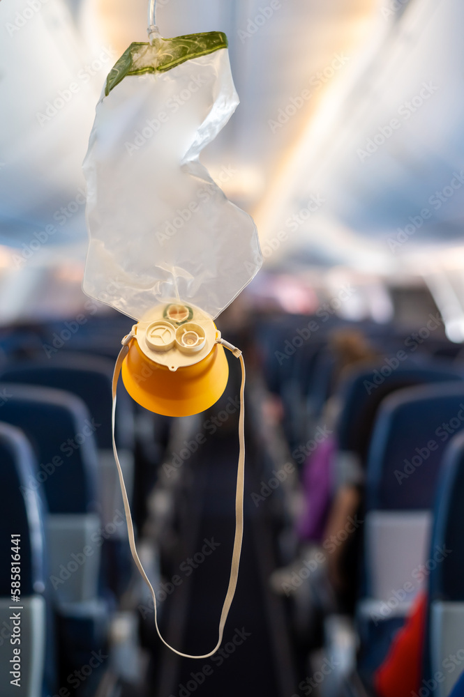 oxygen mask drop from the ceiling compartment on airplane.. Stock Photo ...