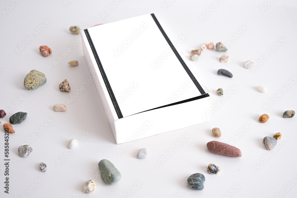 White book with stones on white background. Beautiful photo of ...