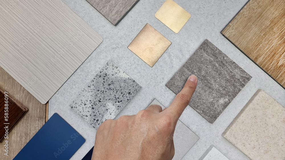 Stockfoto designer's hand choosing interior material samples contains ...