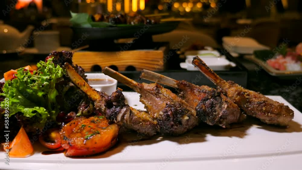 Roasted grilled lamb chops with a luxury fine dining backdrop. Juicy ...