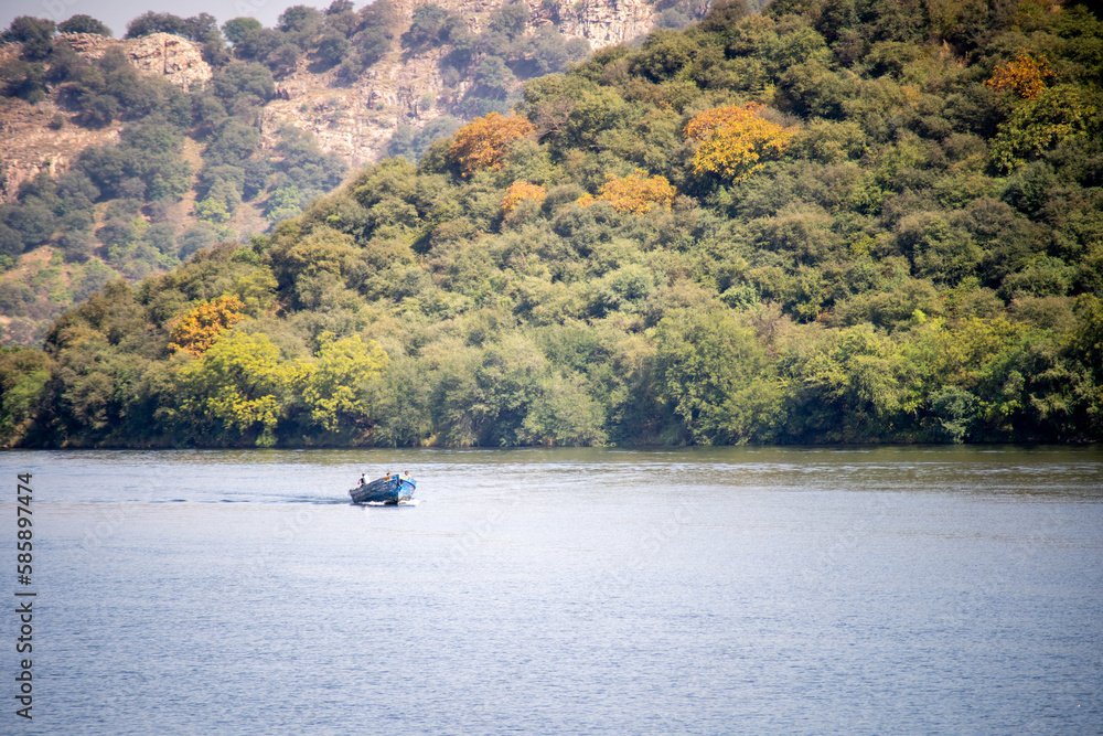 aerial drone shot of handmade boat used by rural villagers to cross ...