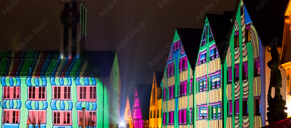 City event where the facades of the houses are illuminated with ...