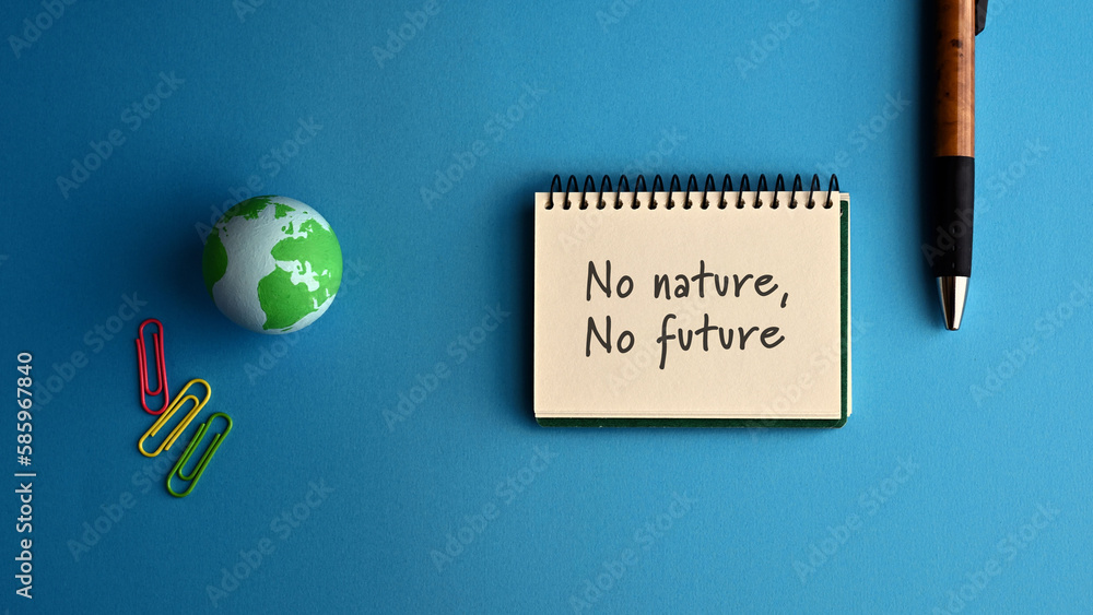 There is a piece of paper with the word No nature, No future. It is eye ...