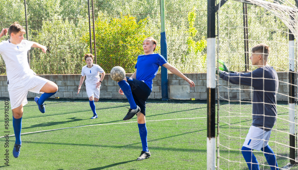 Teens playing soccer football match. Competition between two youth ...