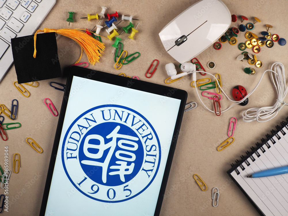 In this photo illustration, Fudan University logo seen displayed on a ...