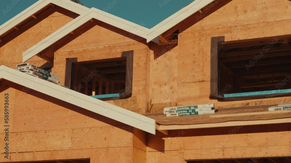 Second story of a plywood house building under construction Stock Video ...