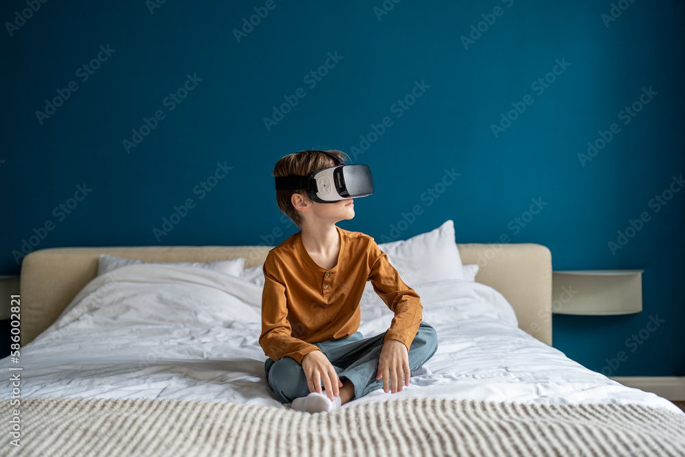 Kid interact using virtual reality headset to interact with the ...