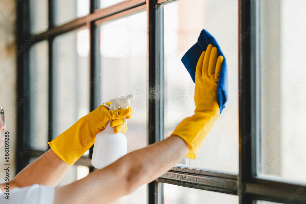 people doing cleaning are using cloths and spraying disinfectant Wipe ...