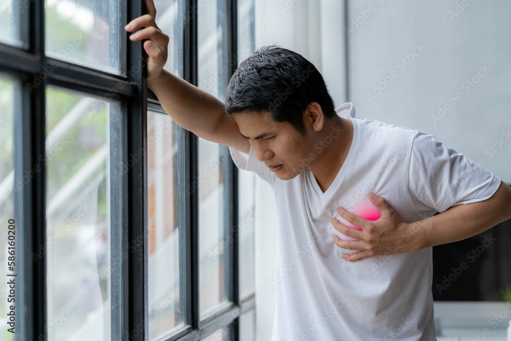Chest pain, young asian man having a heart attack, man suffering from ... Chest pain, young asian man having a heart attack, man suffering from ...
