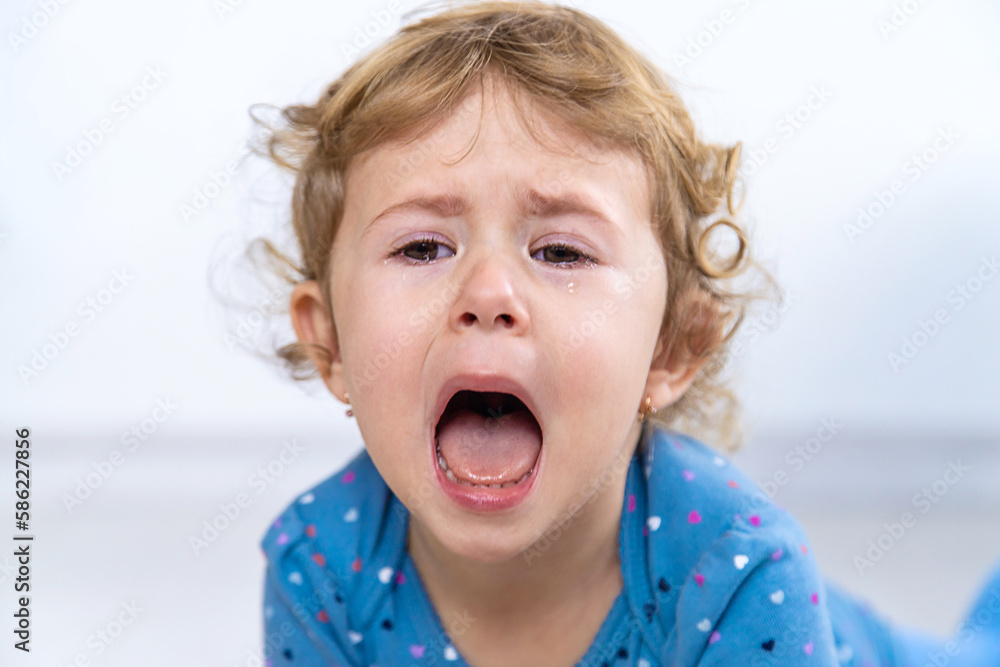 Child crying tears face girl. Selective focus. Stock Photo | Adobe Stock