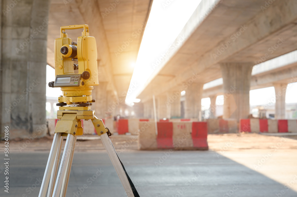 theodolite on construction site Surveyor Engineer uses theodolite to ...