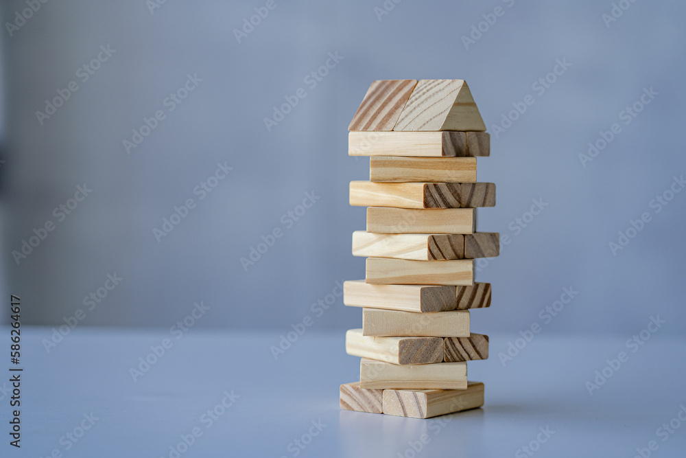 Tower wooden block, builds tower from wooden blocks on grey background ...