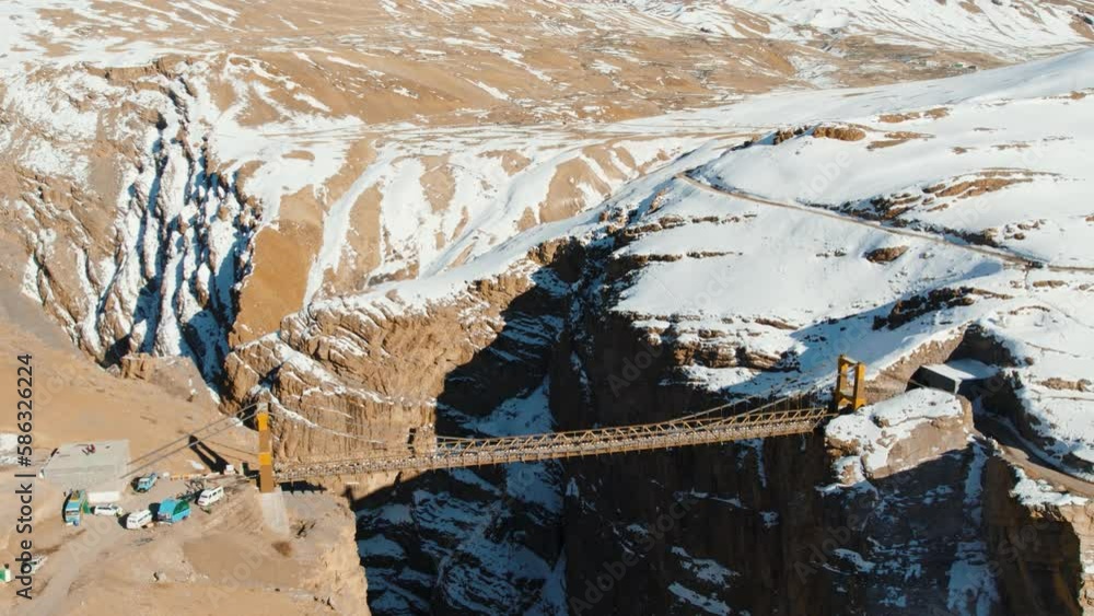 4K aerial view of Chicham bridge connecting Kibber and Chicham villages ...