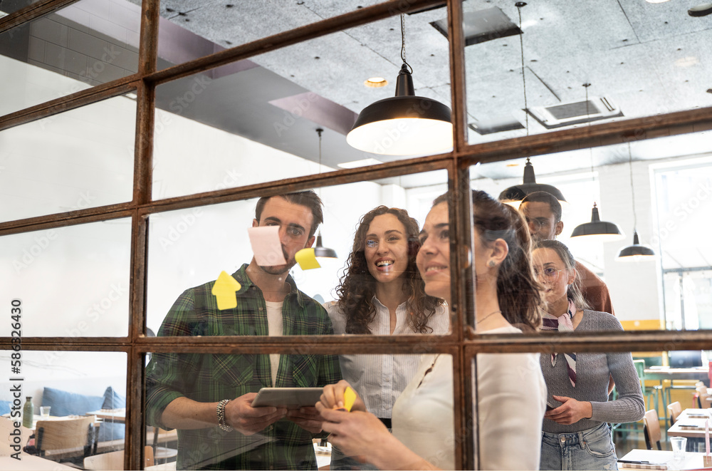 Sharing ideas concepts with paper note writing strategy on wall glass ...
