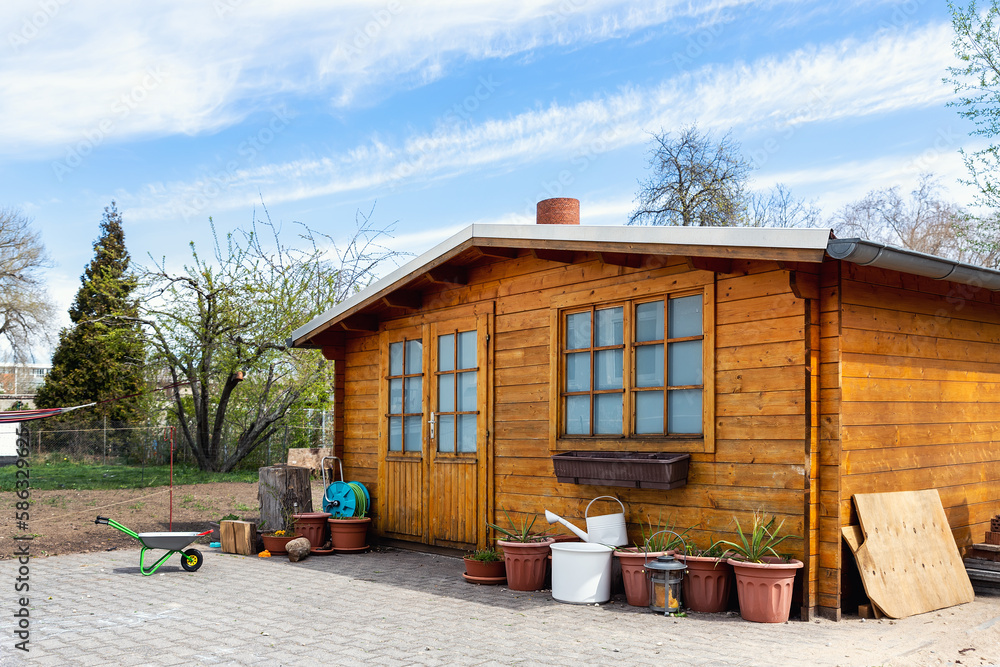 Small beautiful wooden house shed or storage hut for garden tools ...