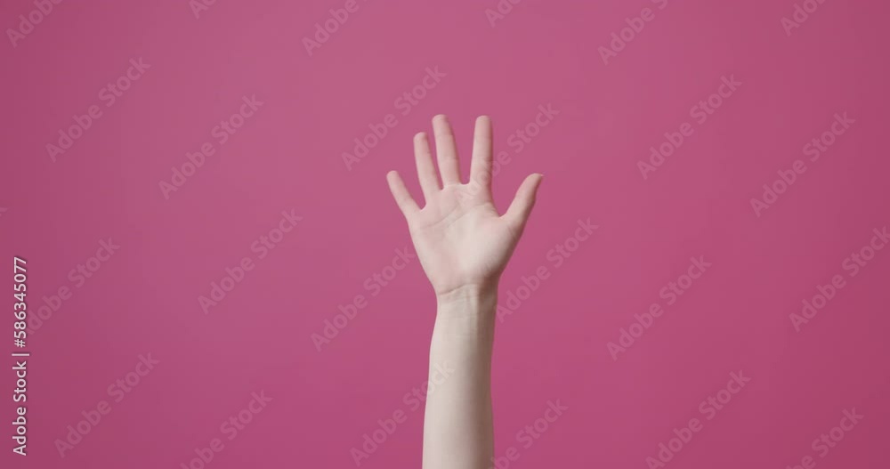 Anonymous woman waving raised hand. Static shot of crop female waving ...
