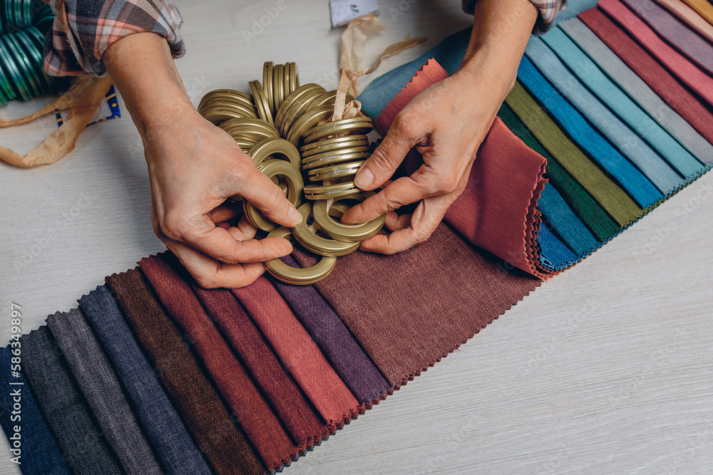 An approximate photo of women's hands sorting through brown copper ...