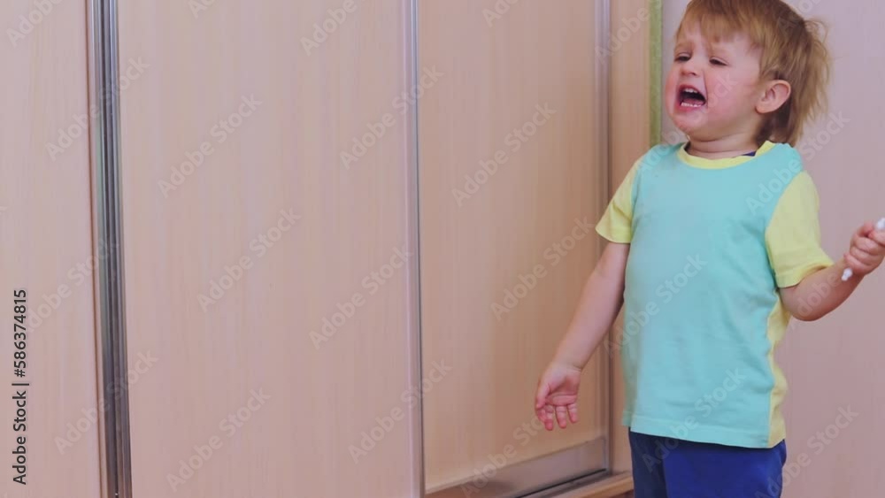 Upset, unhappy child. The greedy boy is crying. Copy space - concept of ...