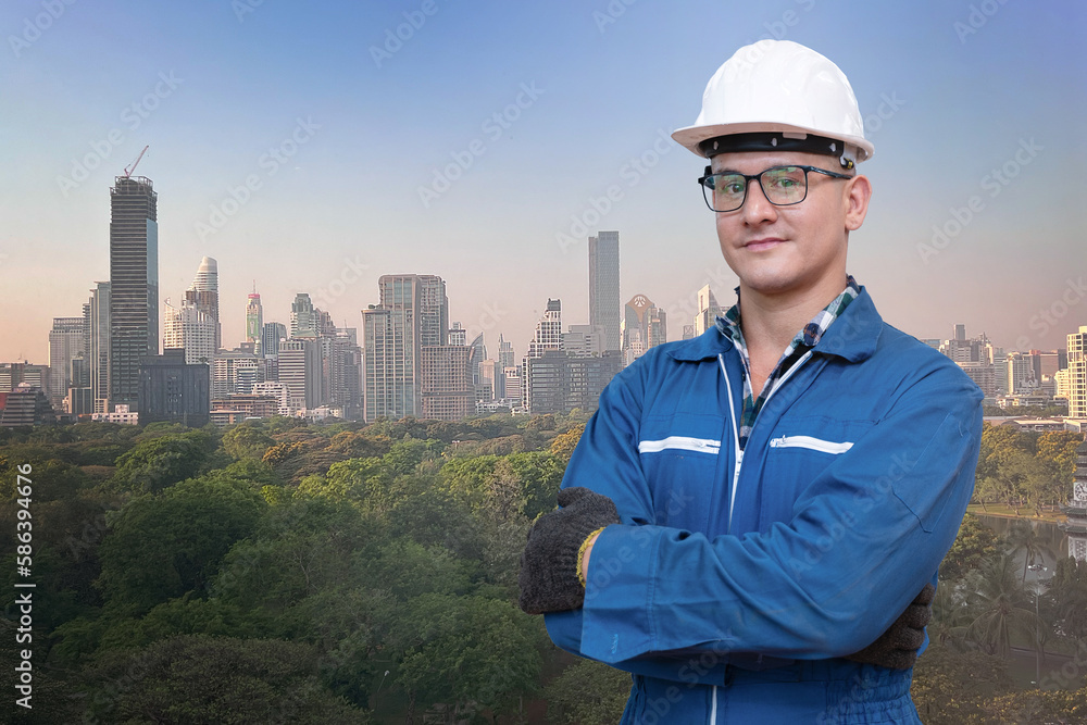 Portrait of manual Indian man worker is standing with confident with ...