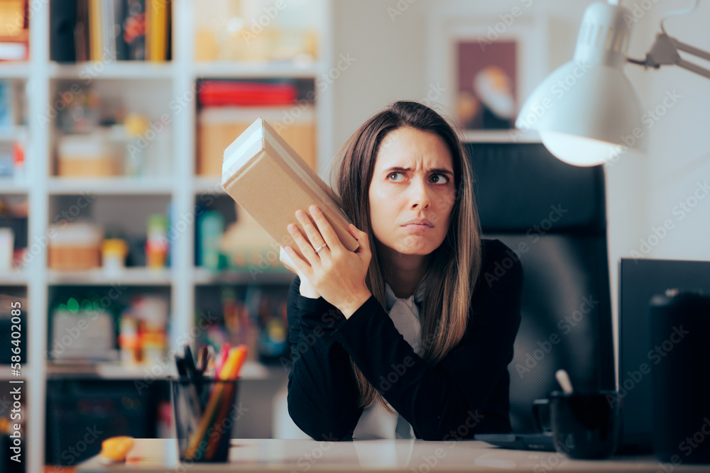 Businesswoman Receiving a Package Wondering what is Inside. Curious ...