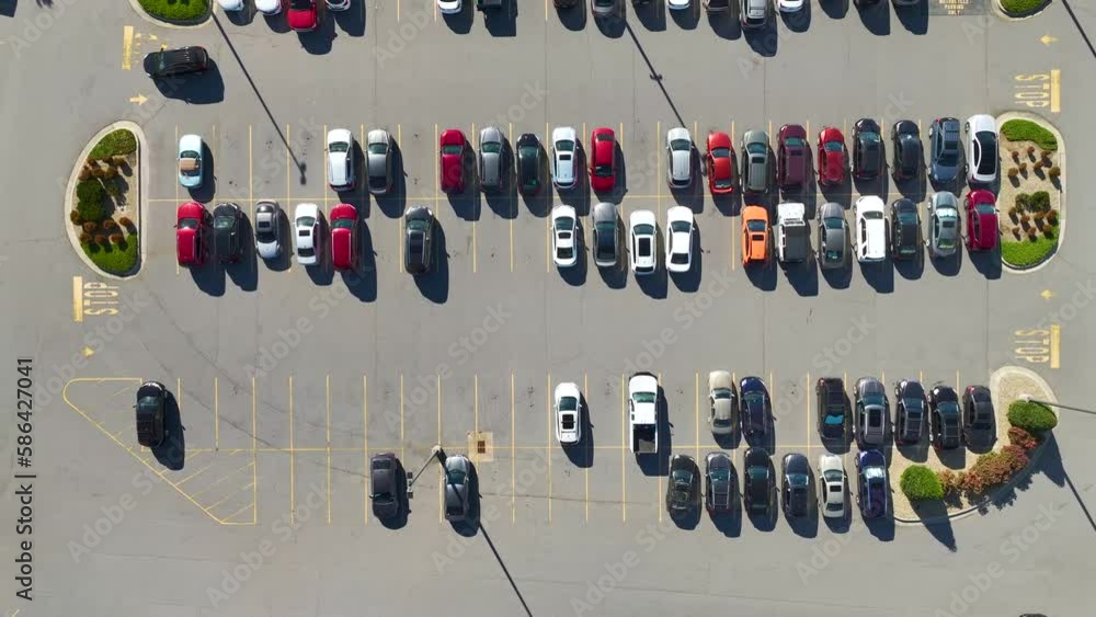 View from above of many parked cars on parking lot with lines and ...