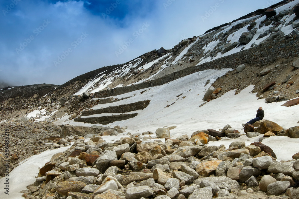 Photographer taking picture at Yumesamdong, Zero point, Sikkim, India ...