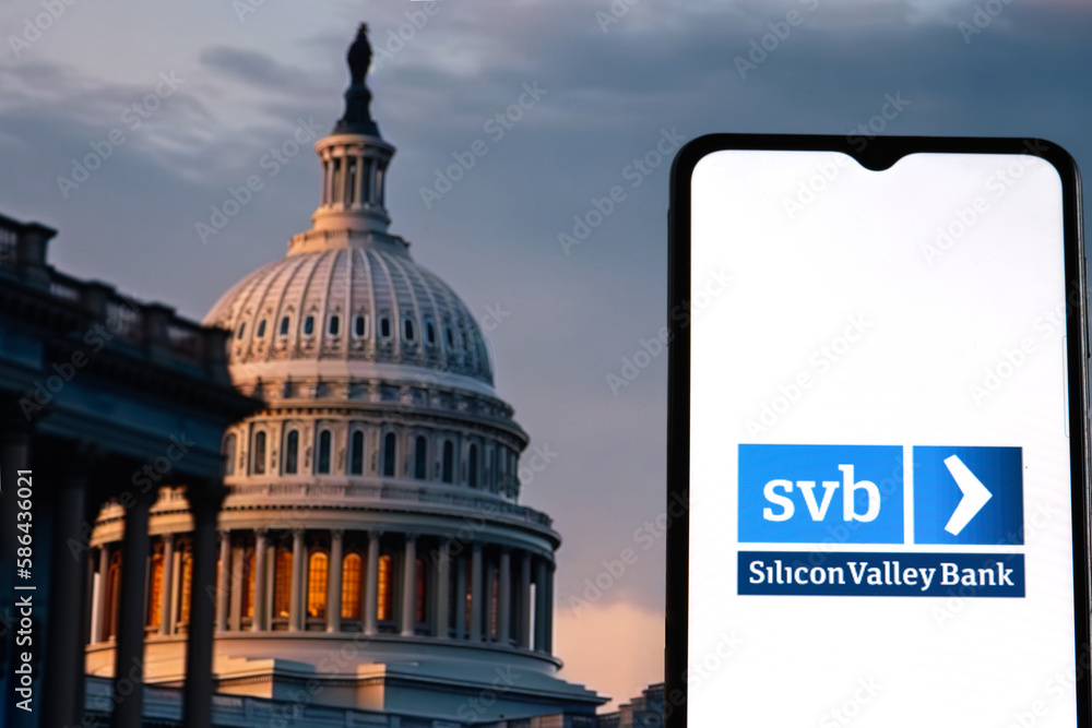 Smartphone with Silicon Valley Bank ( SVB) logo, US Capitol on ...
