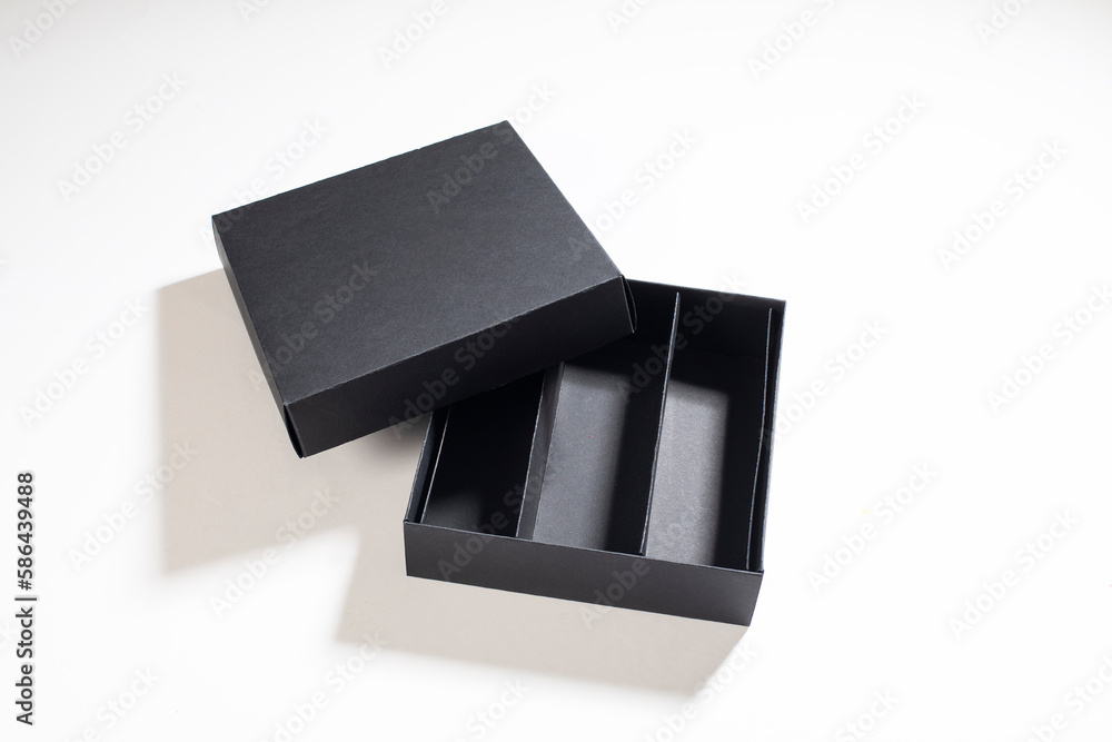 Black cardboard box open on white background, mock up for design ...