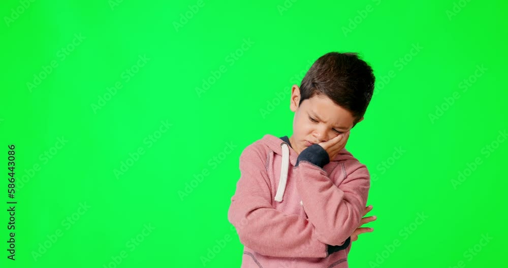 Face, boy and child upset, green screen and angry against a studio ...